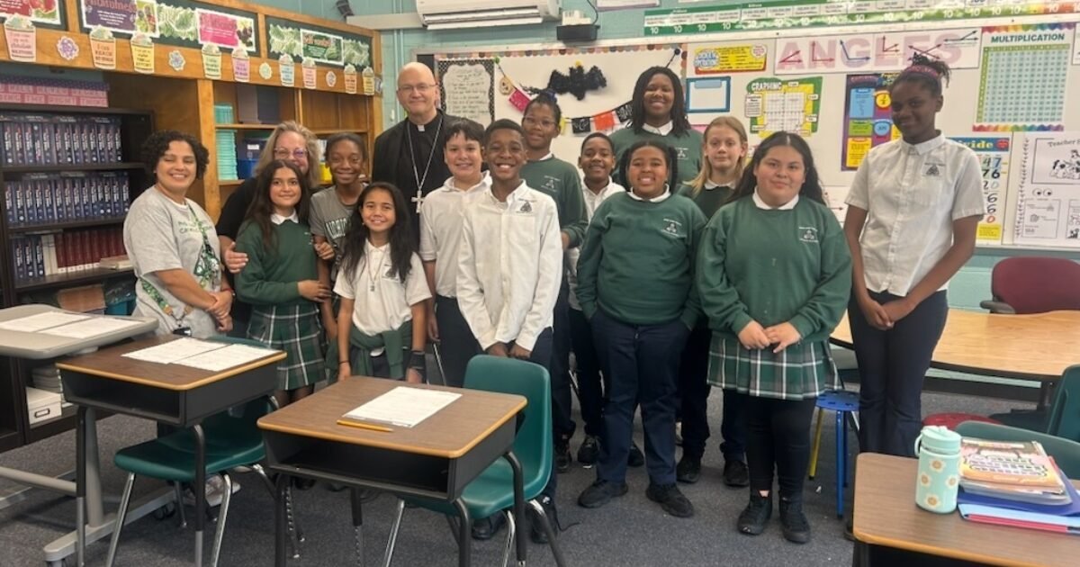 Visiting with students and teachers at Most Holy Trinity School in ...