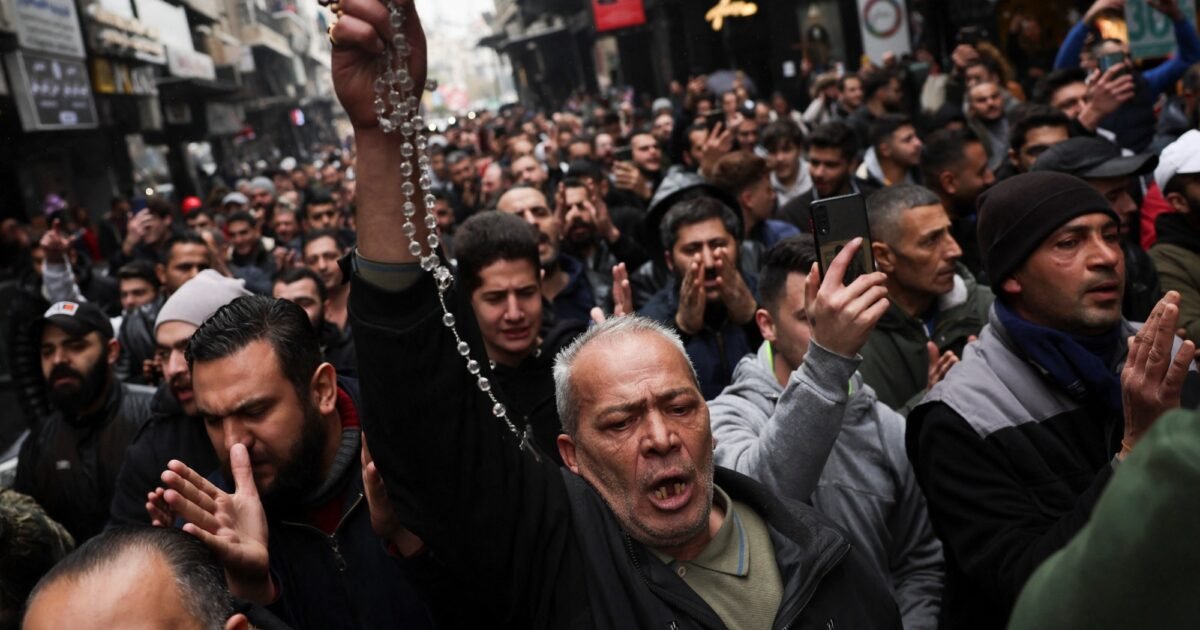 Christians protest in Syria after Christmas tree burned- Detroit Catholic