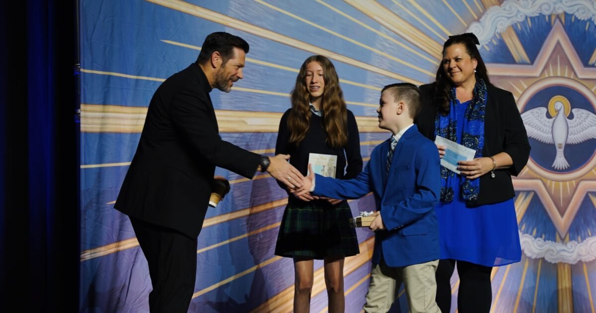 Students share spotlight with Fr. Schmitz after crafting media inspired ...